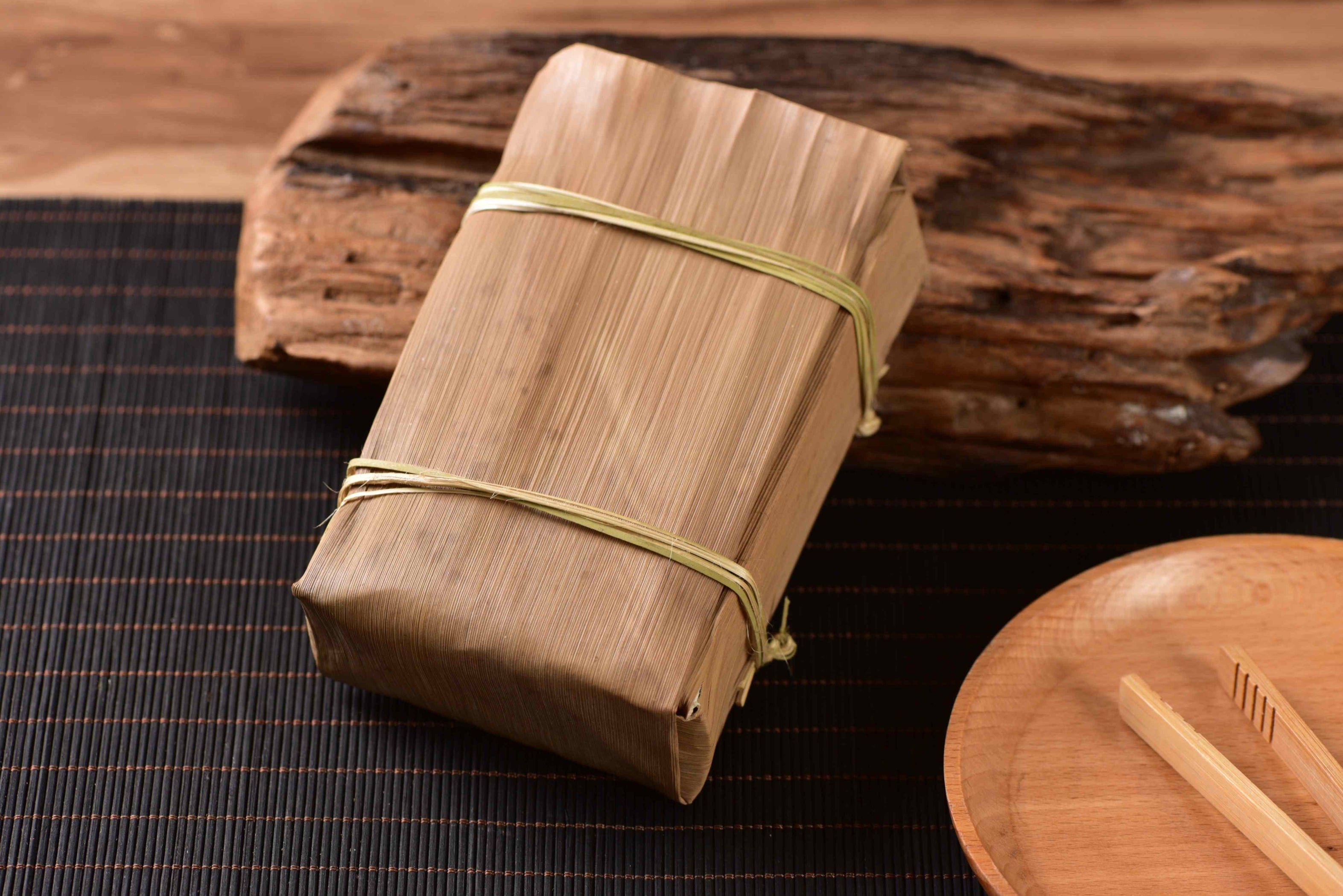 2010 Menghai "Bamboo Wrapped" Ripe Pu-erh Tea Brick — Yunnan Sourcing ...